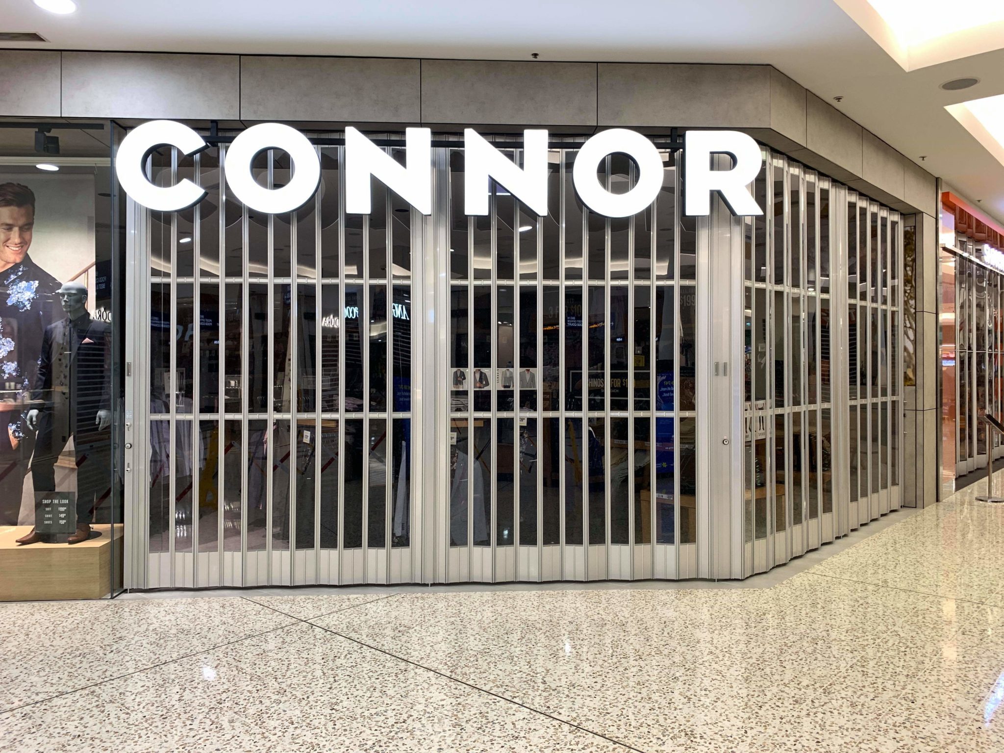 STYLISH SLIMLINE FOLDING DOOR SECURES RAG'S NEW CONNOR STORE AT ...