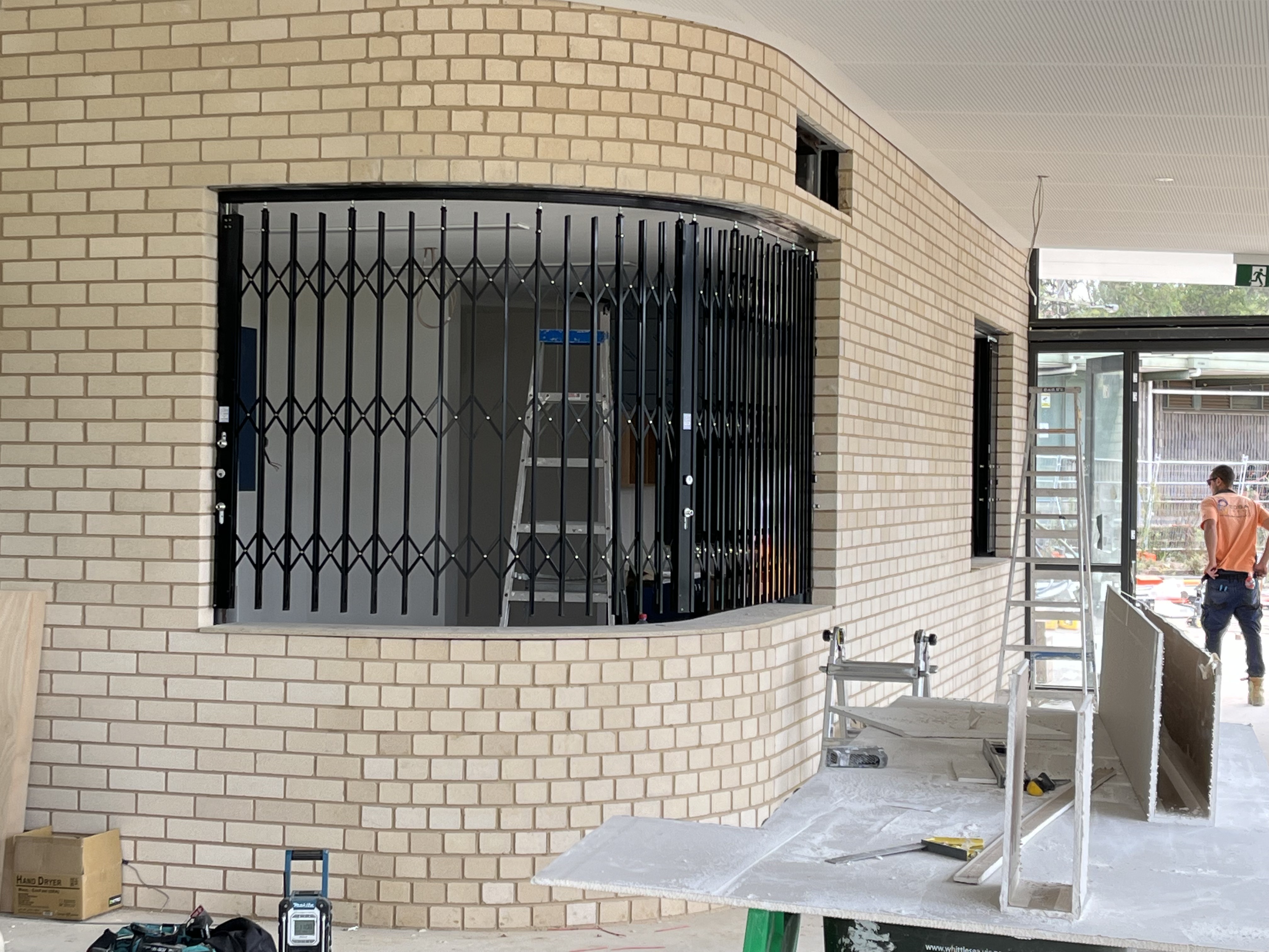Folding Curved Security Shutters & Gates - Retail & Commercial