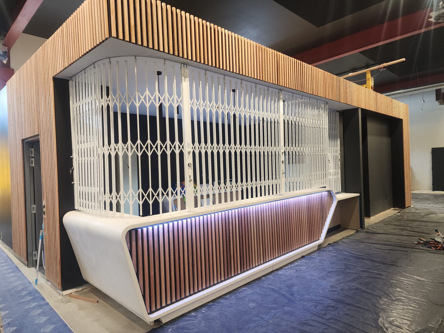 Folding Curved Security Shutters & Gates - Retail & Commercial