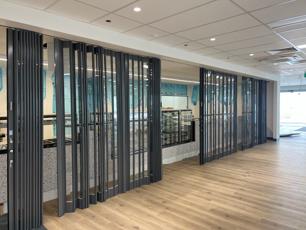 Elegant and functional Commercial Bi-fold doors - Australian Trellis Door